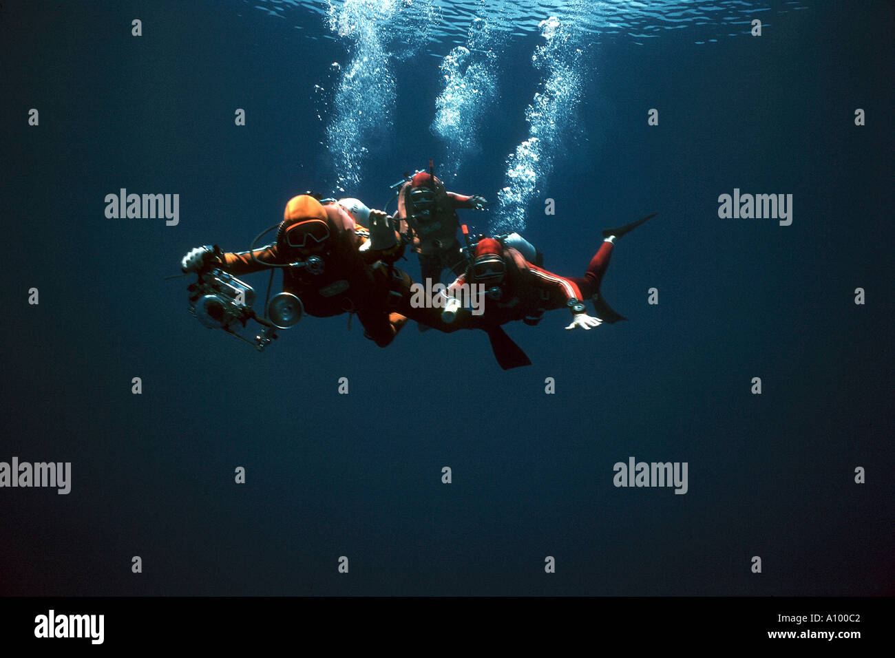 three sub aqua divers in Mediterranean Stock Photo - Alamy