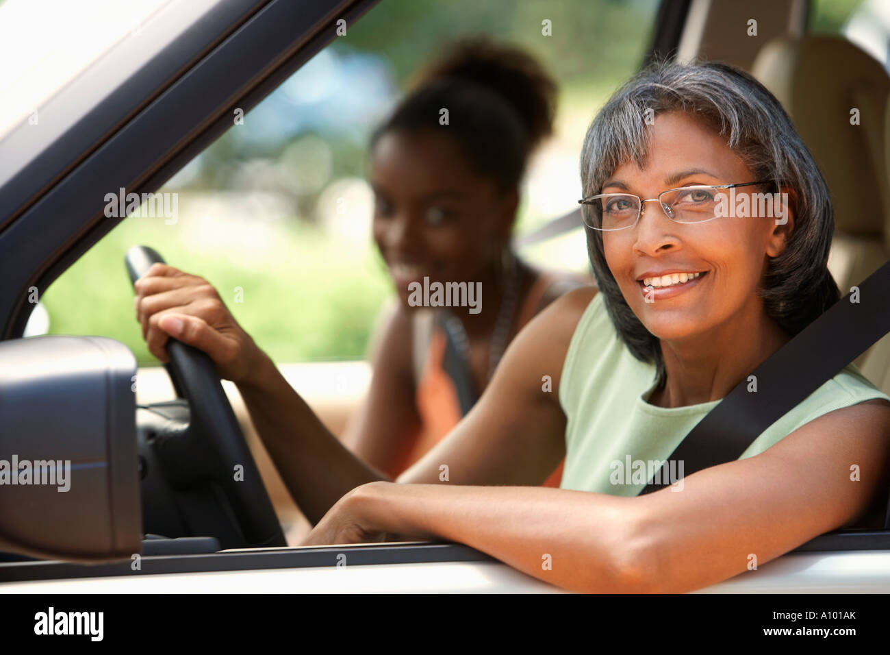 Middle-aged African woman driving Stock Photo - Alamy