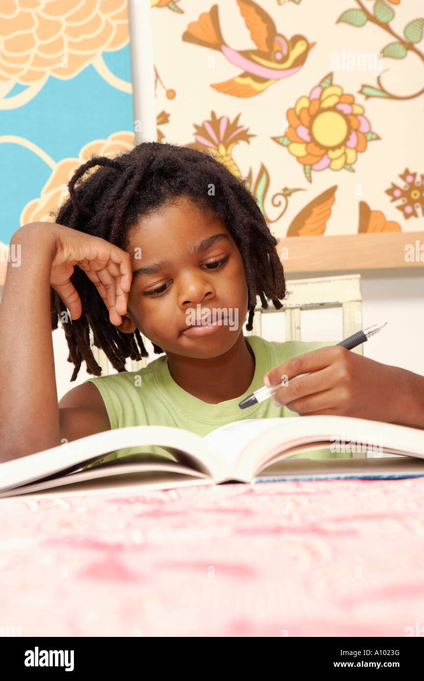 Young African girl doing her homework Stock Photo - Alamy