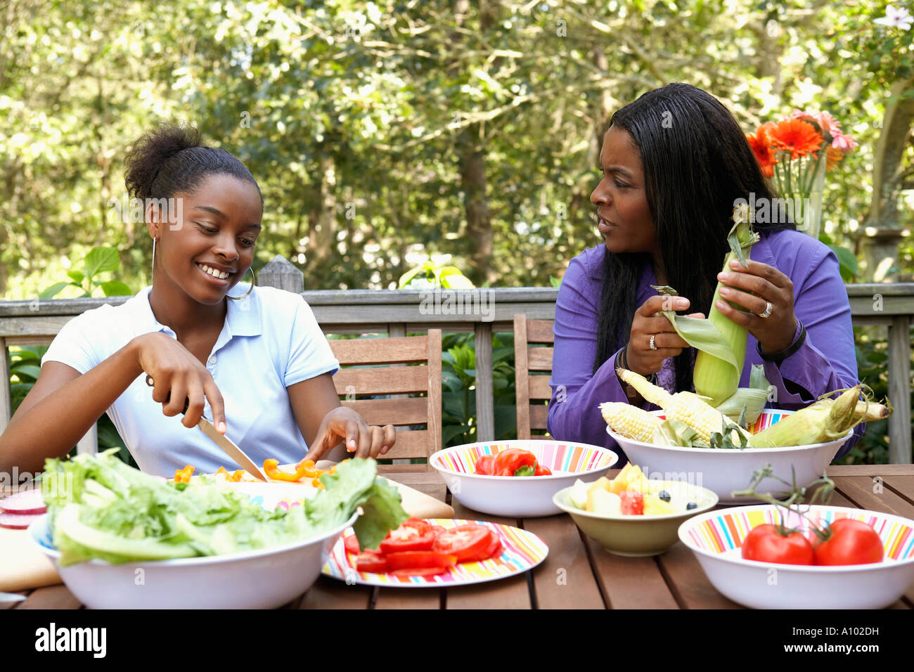 Young African girls eating together outdoors Stock Photo - Alamy