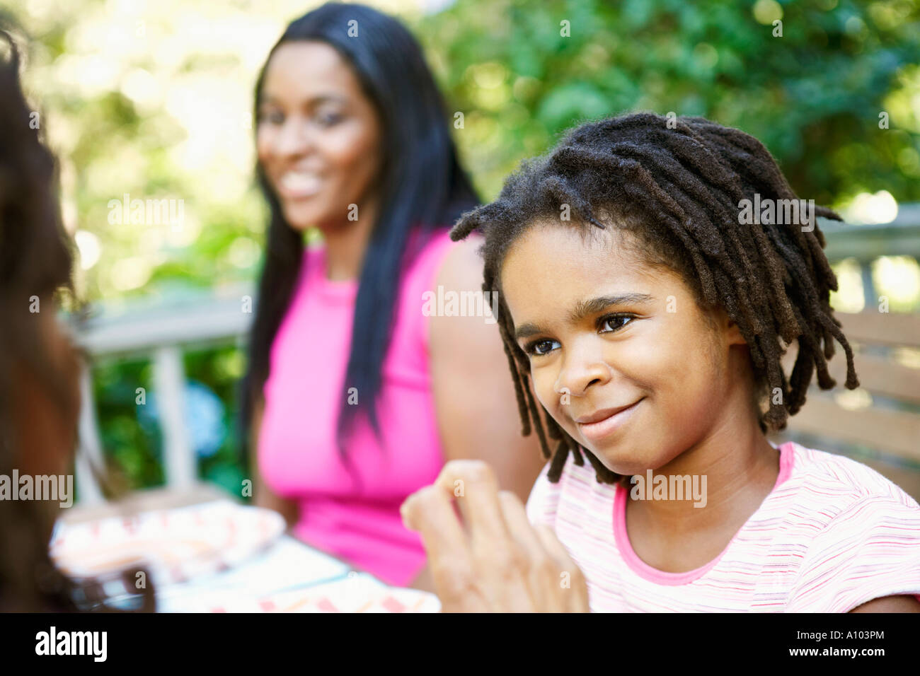 Young African girl smiling outdoors Stock Photo - Alamy