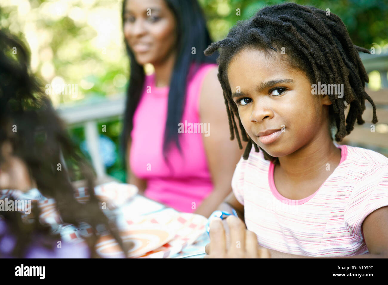 Young African girl smiling outdoors Stock Photo - Alamy