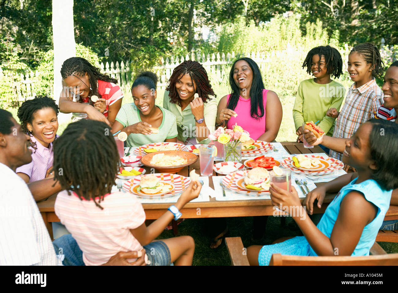 African family eating together outdoors Stock Photo - Alamy