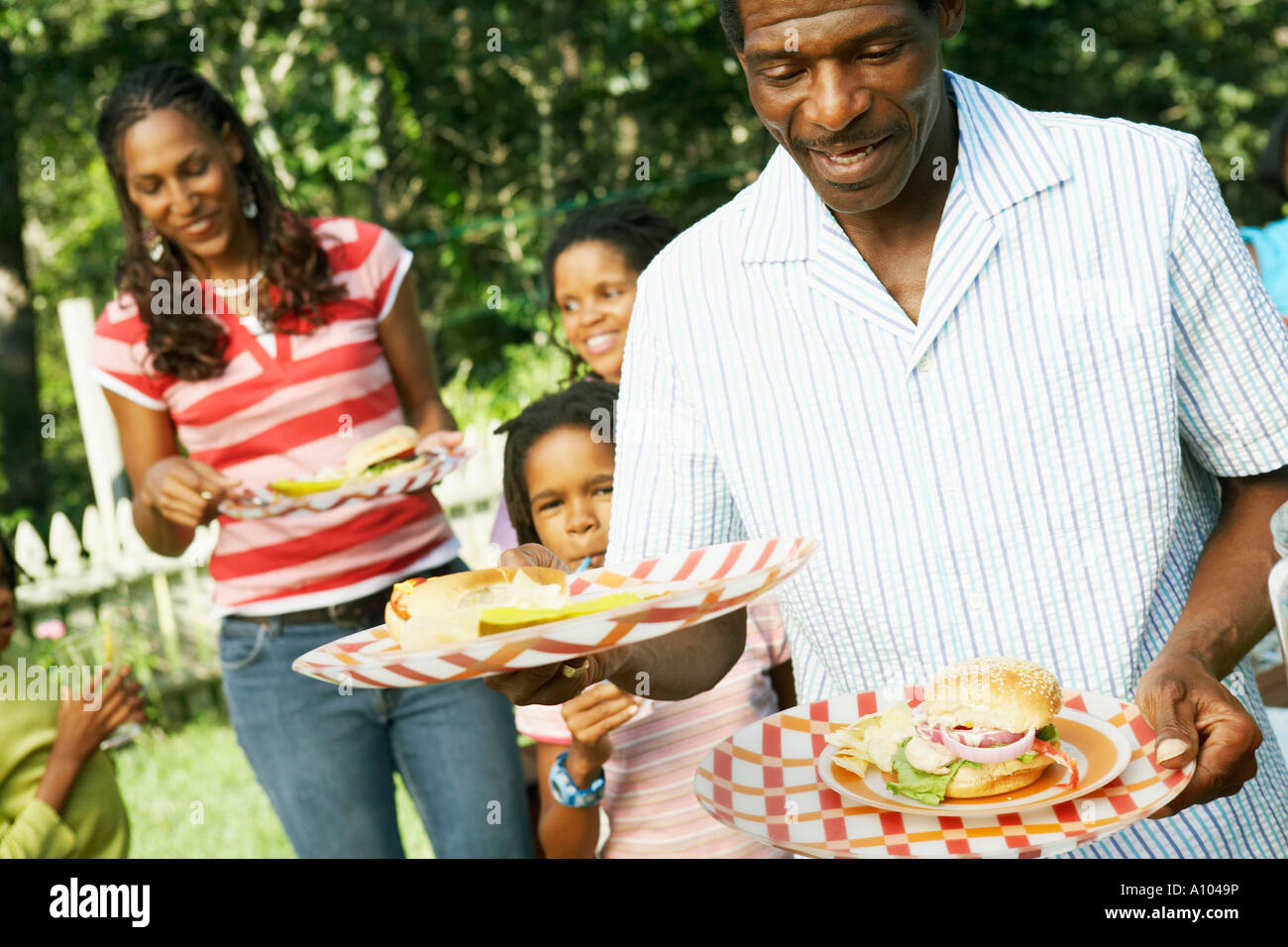 African family eating together outdoors Stock Photo - Alamy