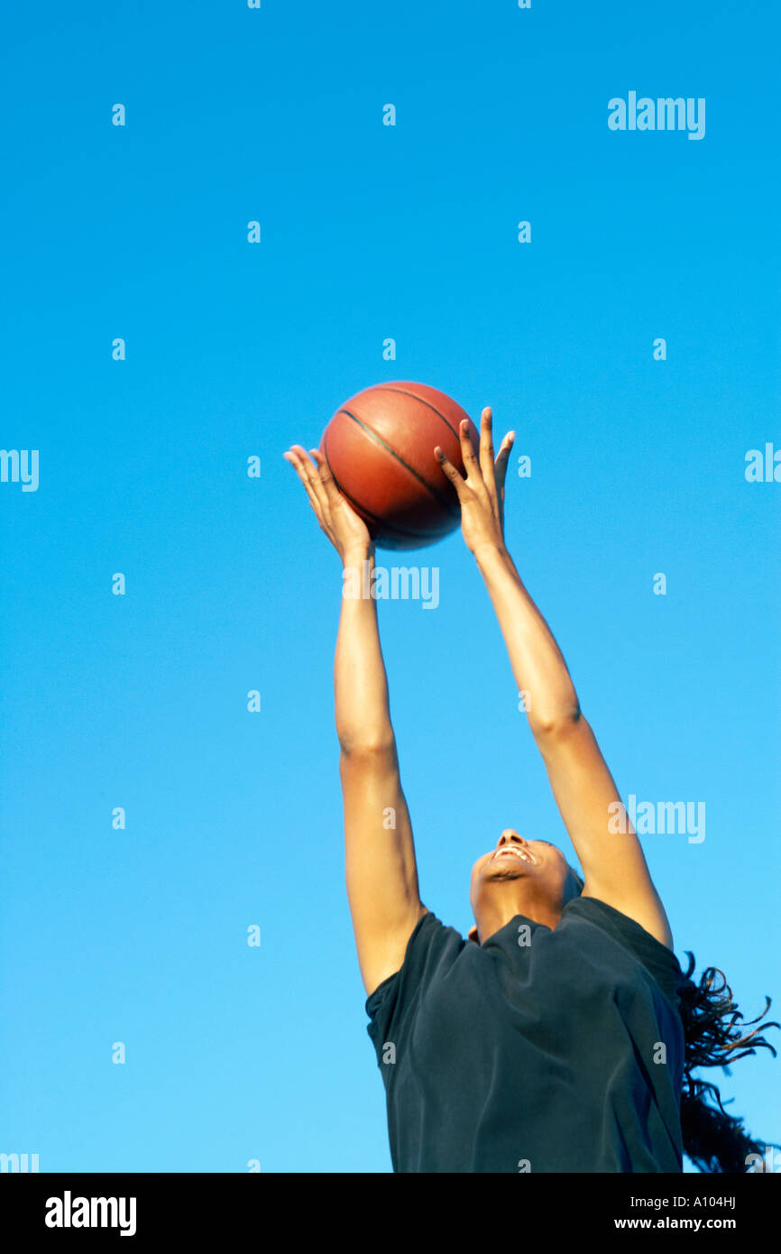 African man reaching for a basketball Stock Photo - Alamy