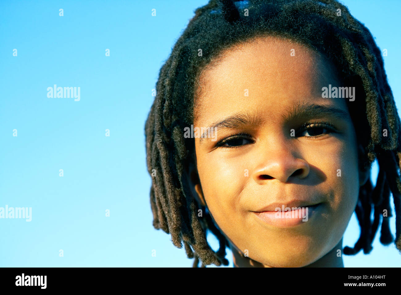 Young African boy smiling Stock Photo - Alamy