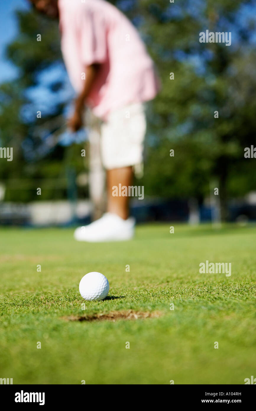 African man playing golf Stock Photo - Alamy