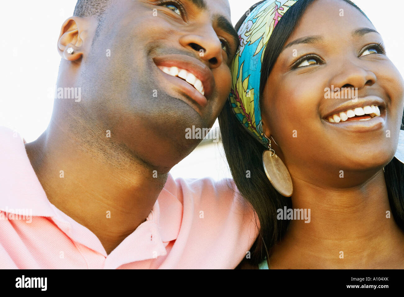 Young African couple hugging Stock Photo - Alamy