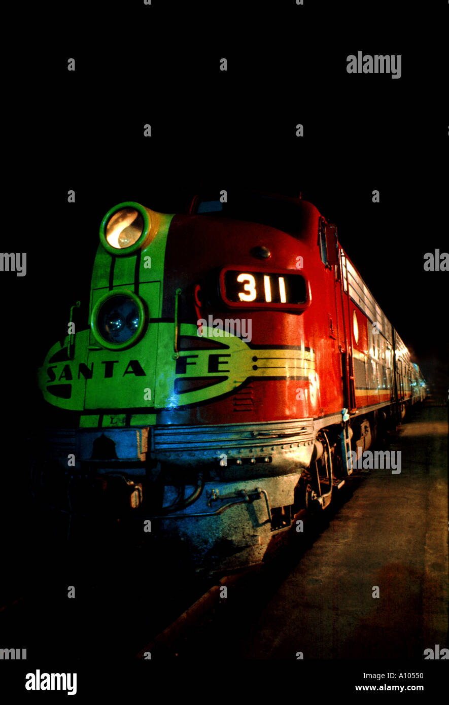 Diesel locomotive at train station at night Stock Photo - Alamy
