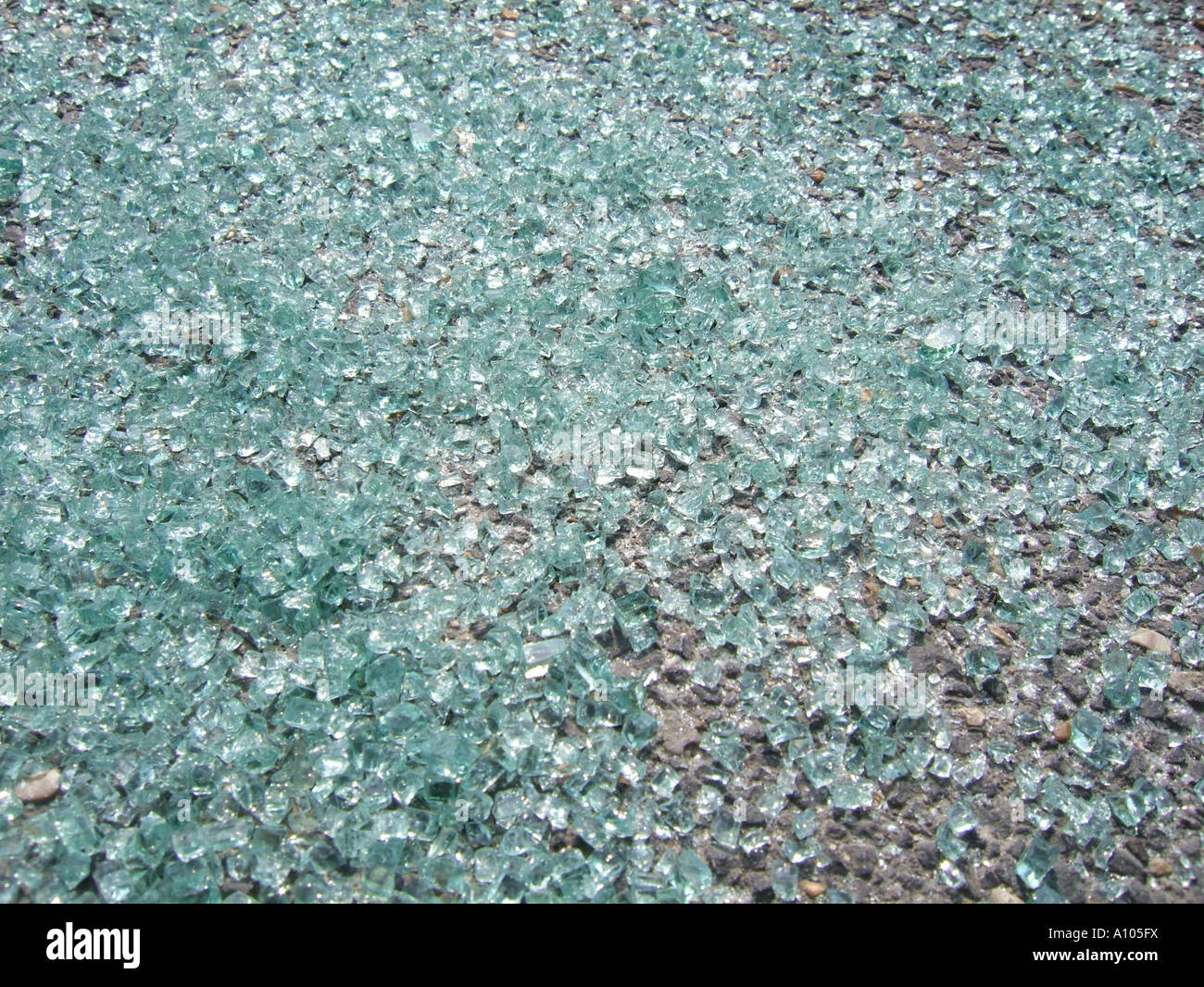 glass from smashed car window on road surface Stock Photo - Alamy