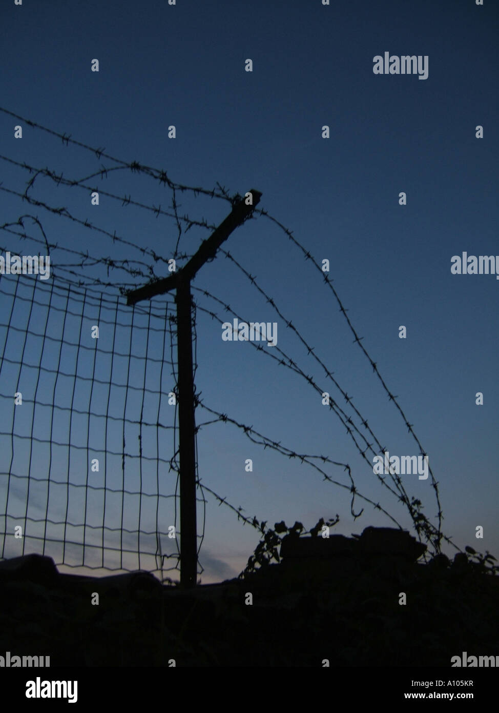 Gate barbed wire night hi-res stock photography and images - Alamy