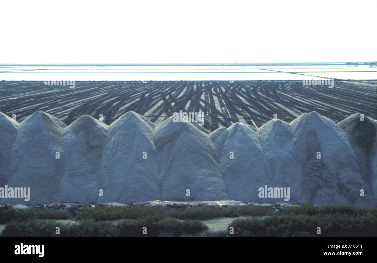 Sea salt piles with salt lagoon beyond, Salin de Giraud Bouches du ...