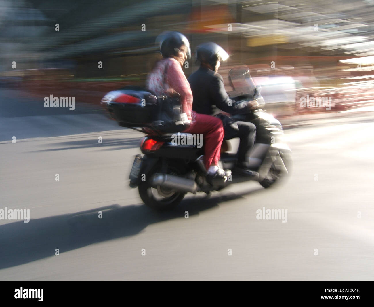people riding scooter in rome italy Stock Photo - Alamy