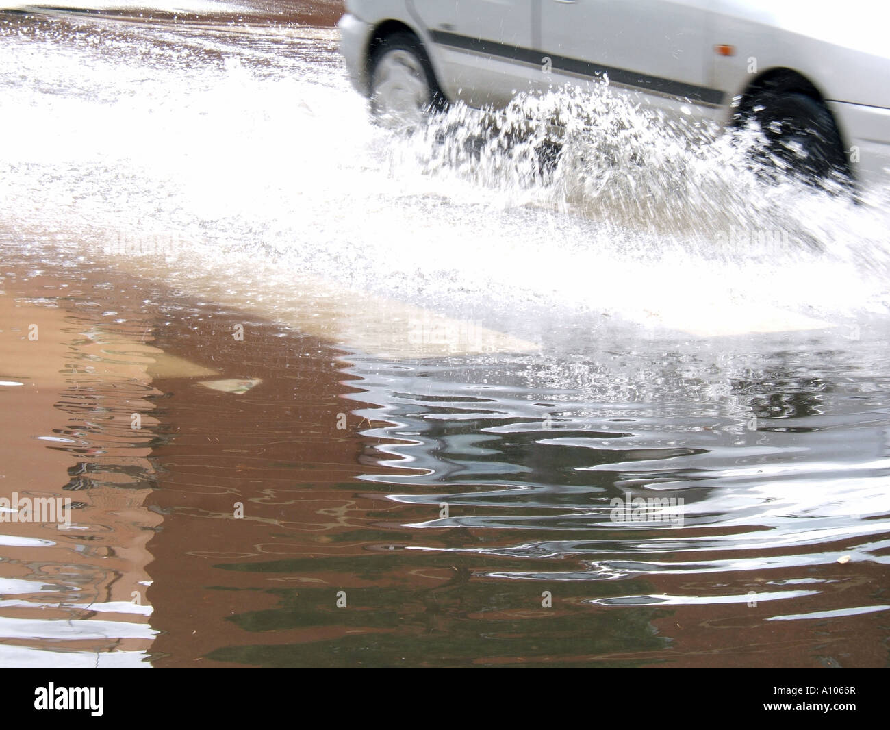 car on flooded road Stock Photo - Alamy
