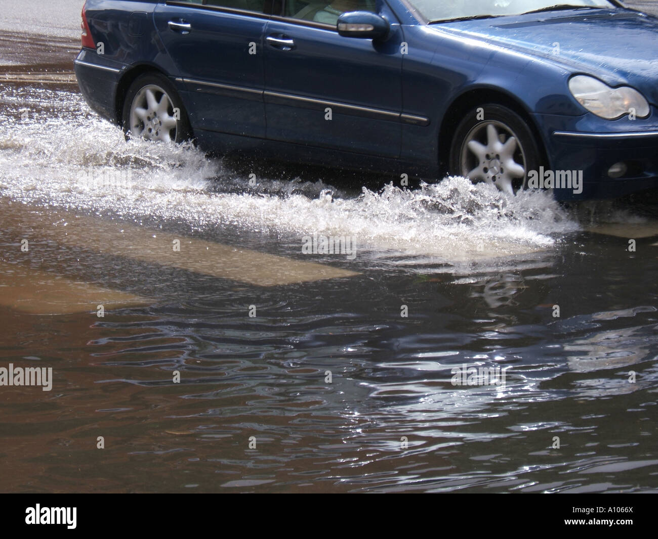car on flooded road Stock Photo - Alamy