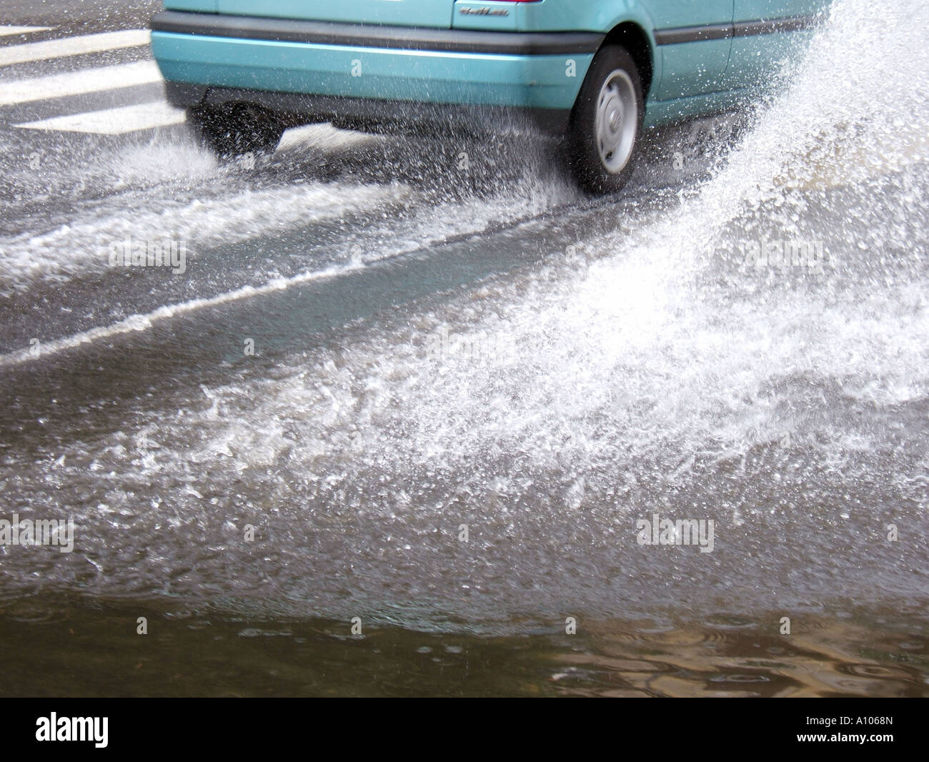 car on flooded road Stock Photo - Alamy