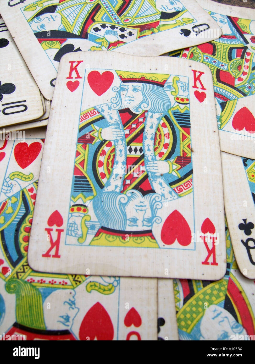 playing cards discarded on wet road Stock Photo - Alamy