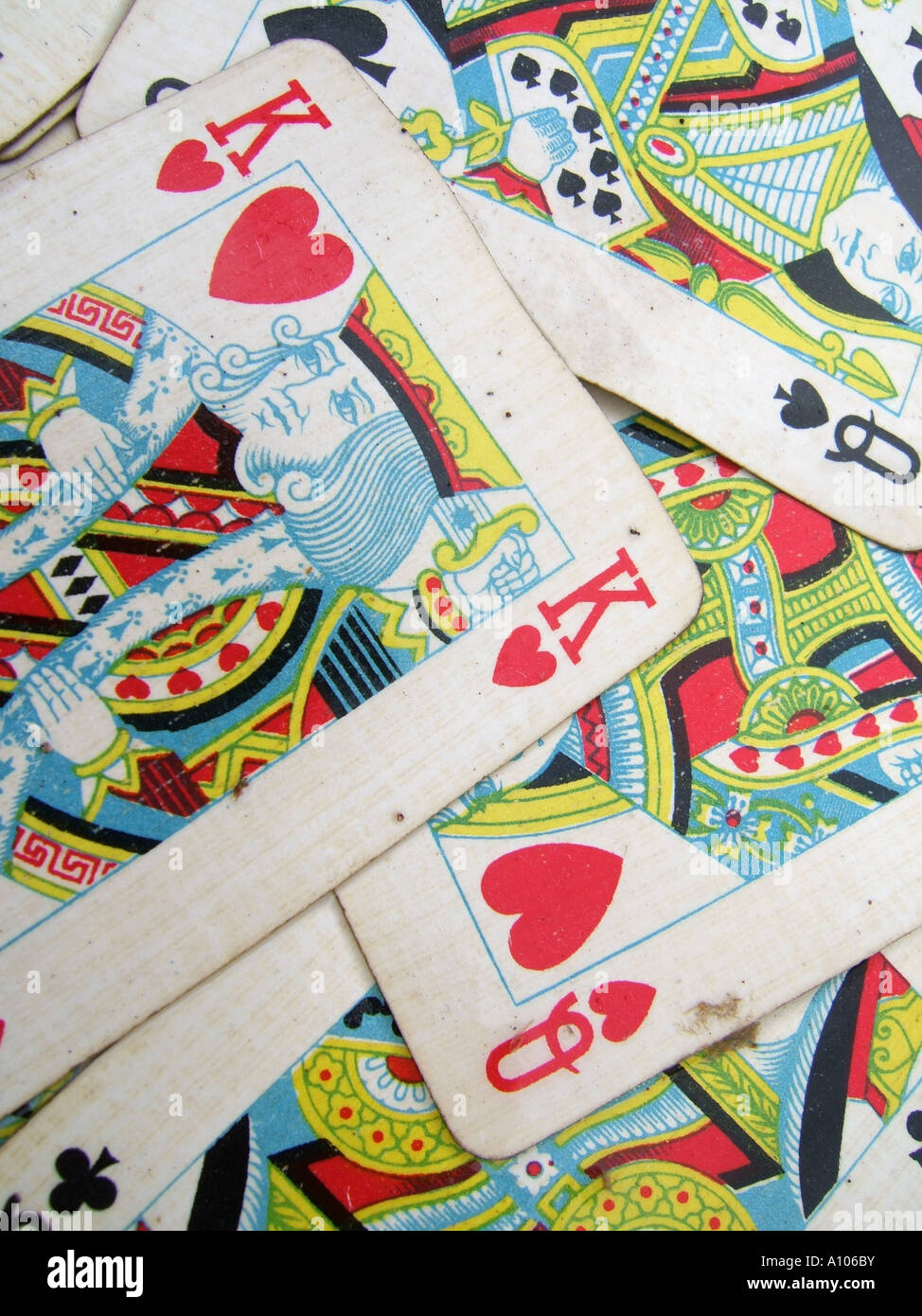playing cards discarded on wet road Stock Photo - Alamy
