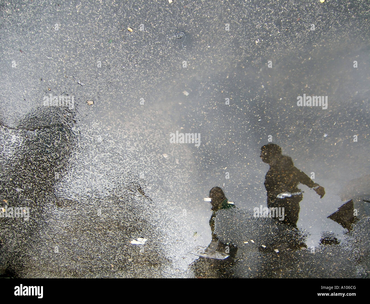 two friends walking in rain Stock Photo - Alamy