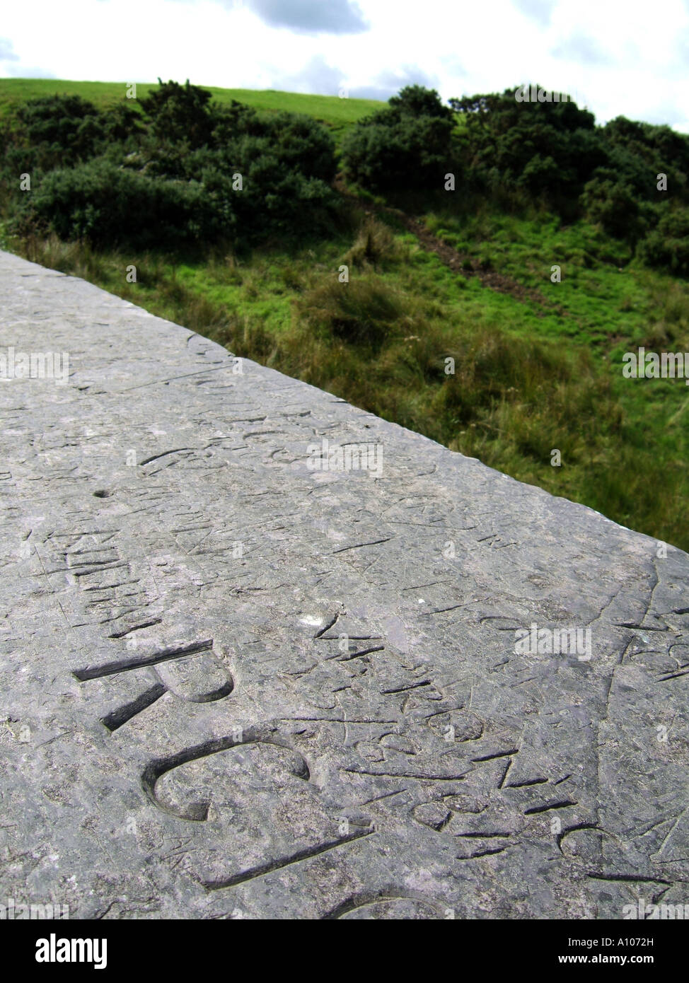 letters carved onto slate wall in countryside Stock Photo - Alamy