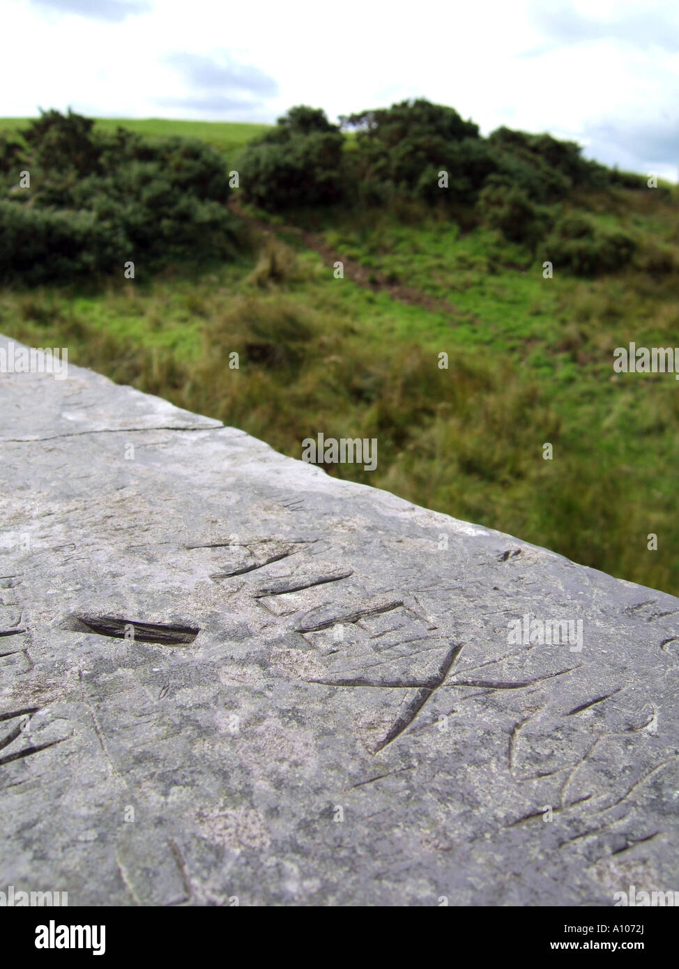 letters carved onto slate wall in countryside Stock Photo - Alamy