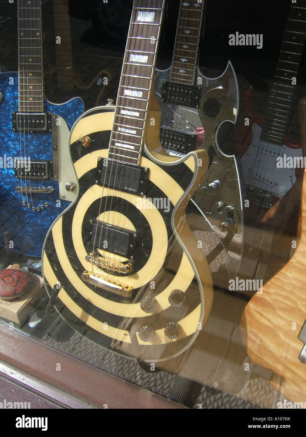 electric guitars in shop window Stock Photo - Alamy