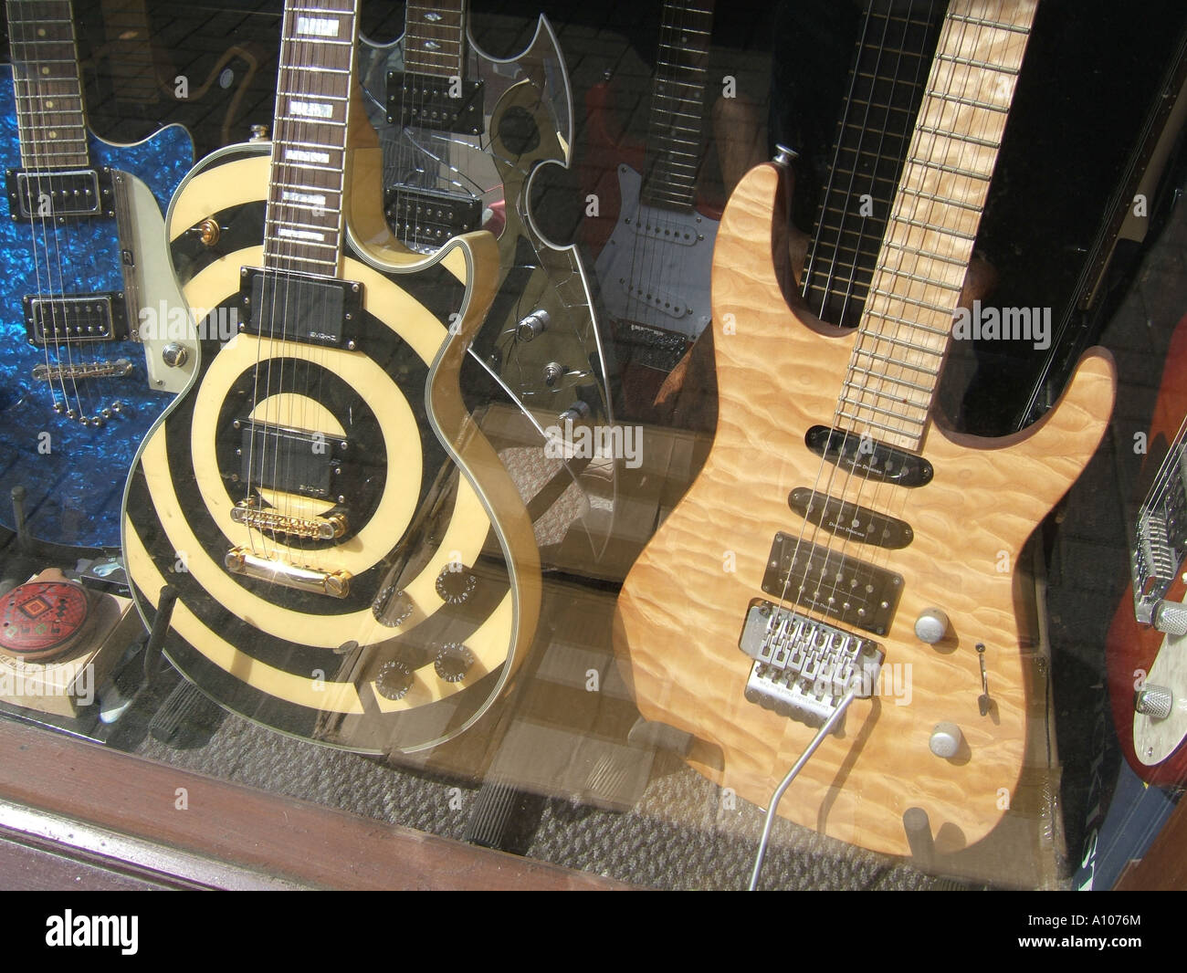 electric guitars in shop window Stock Photo - Alamy