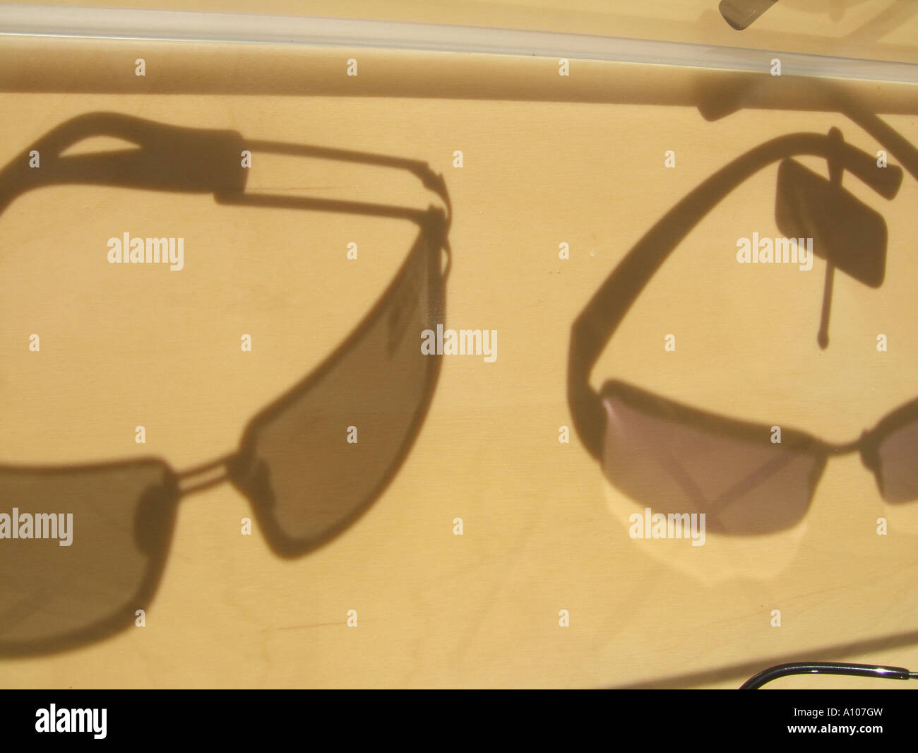 shadow of sunglasses in shop window Stock Photo - Alamy