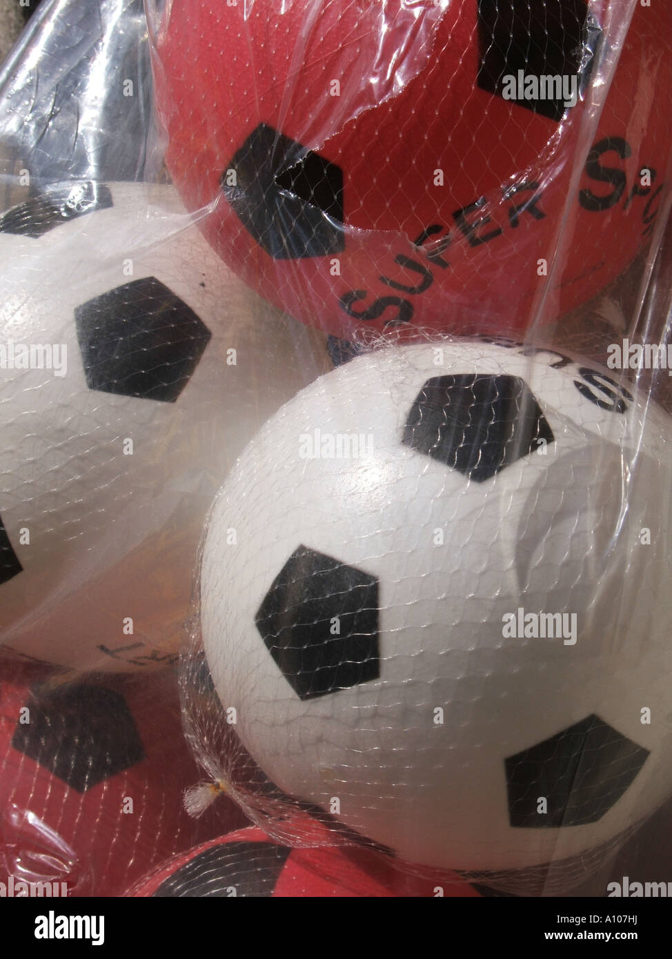 Orange football in net in shop display hi-res stock photography and ...