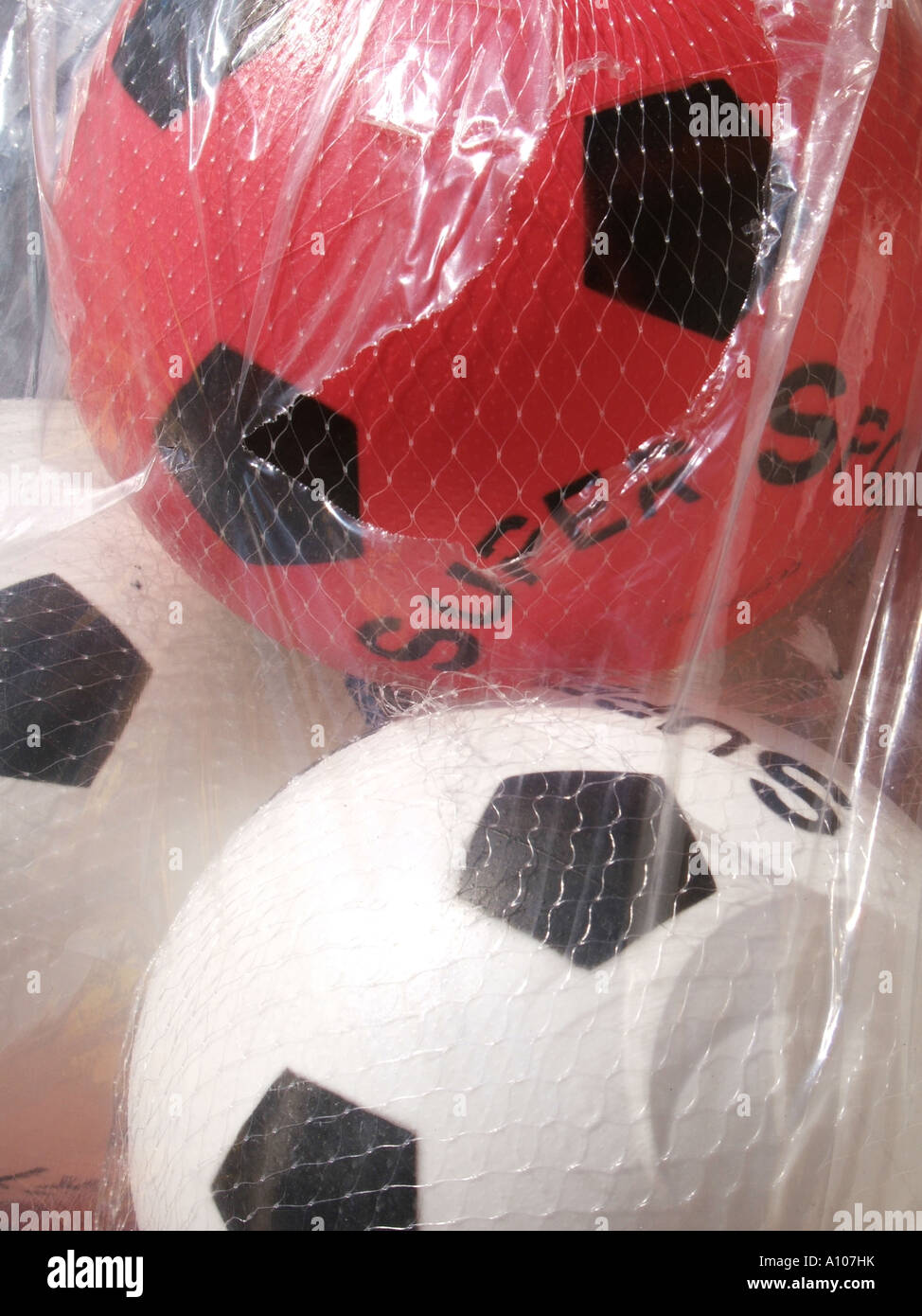 Orange football in net in shop display hi-res stock photography and ...