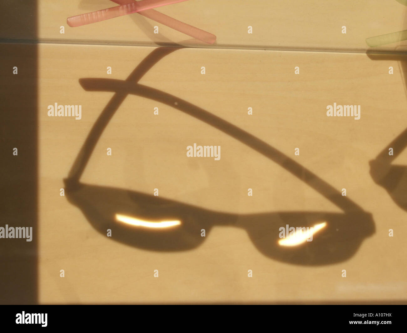 shadow of sunglasses in shop window Stock Photo - Alamy