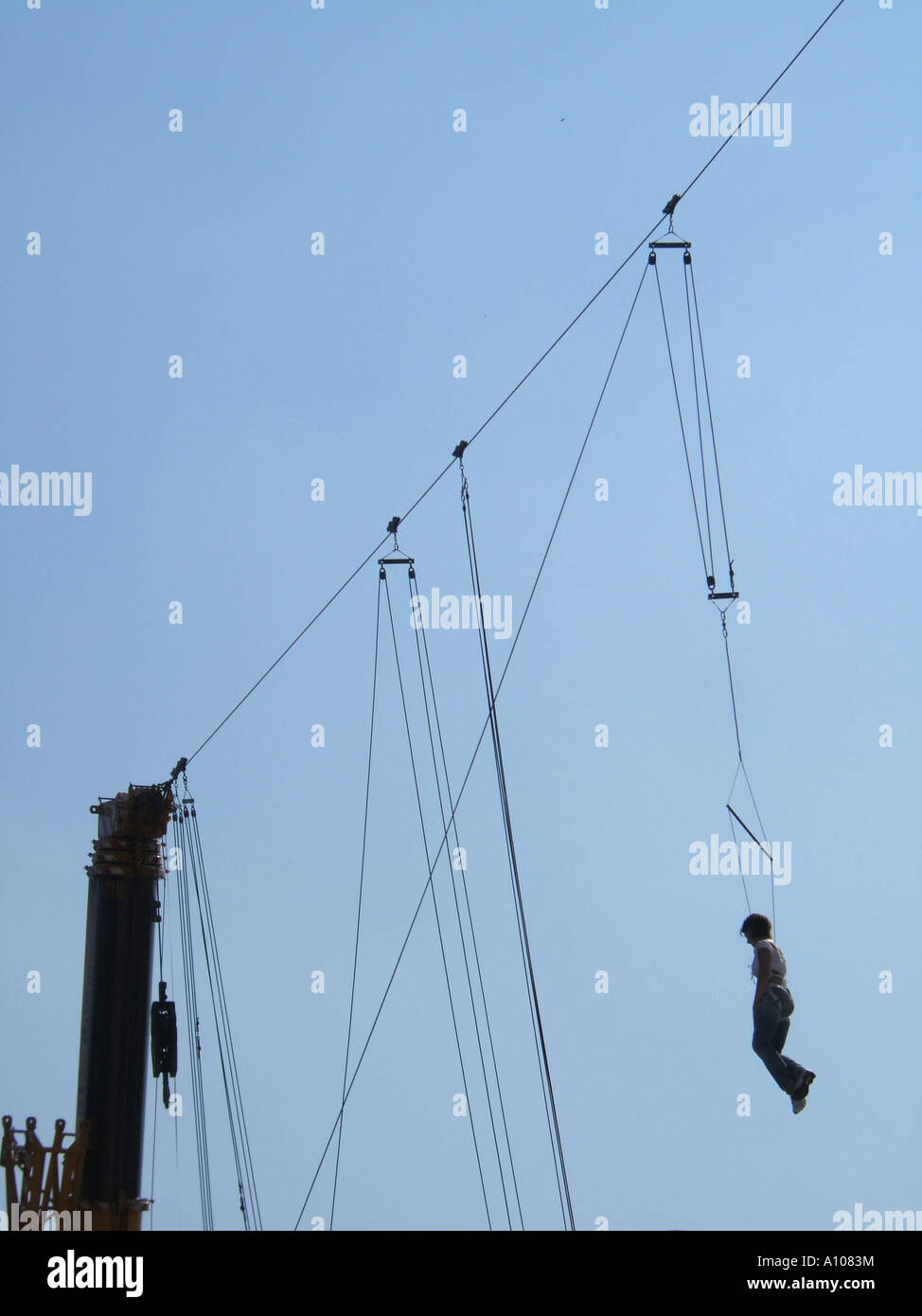 woman entertainer trapeze artist hanging on high wire rope Stock Photo ...