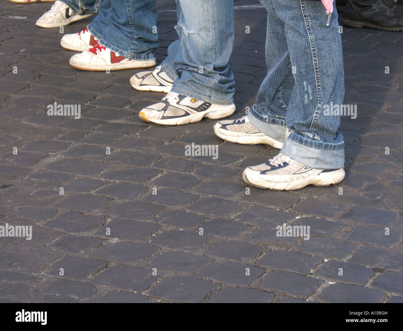 person feet legs walking in street in town Stock Photo - Alamy
