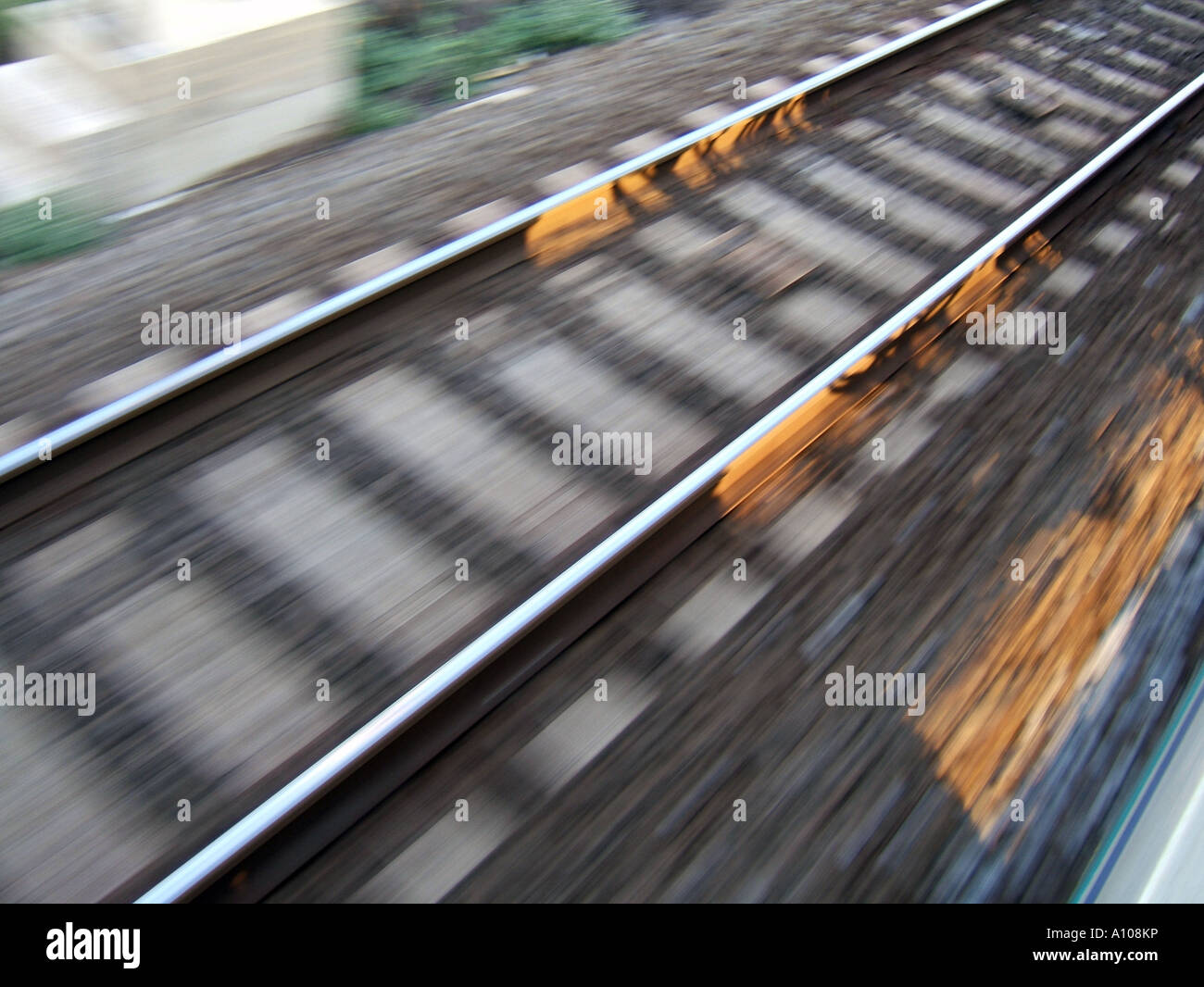 view of train tracks sleepers from fast train window Stock Photo - Alamy