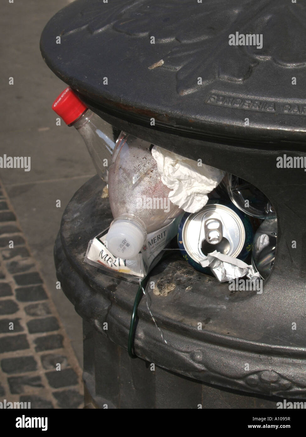 bin full of litter in town Stock Photo - Alamy