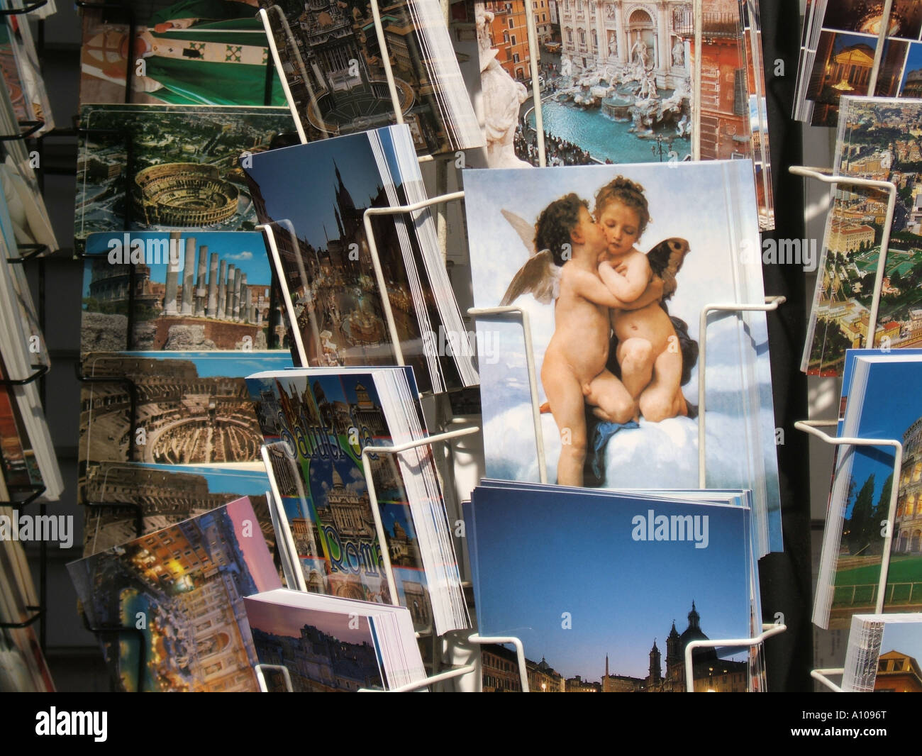 postcards on rack in gift shop in rome Stock Photo - Alamy
