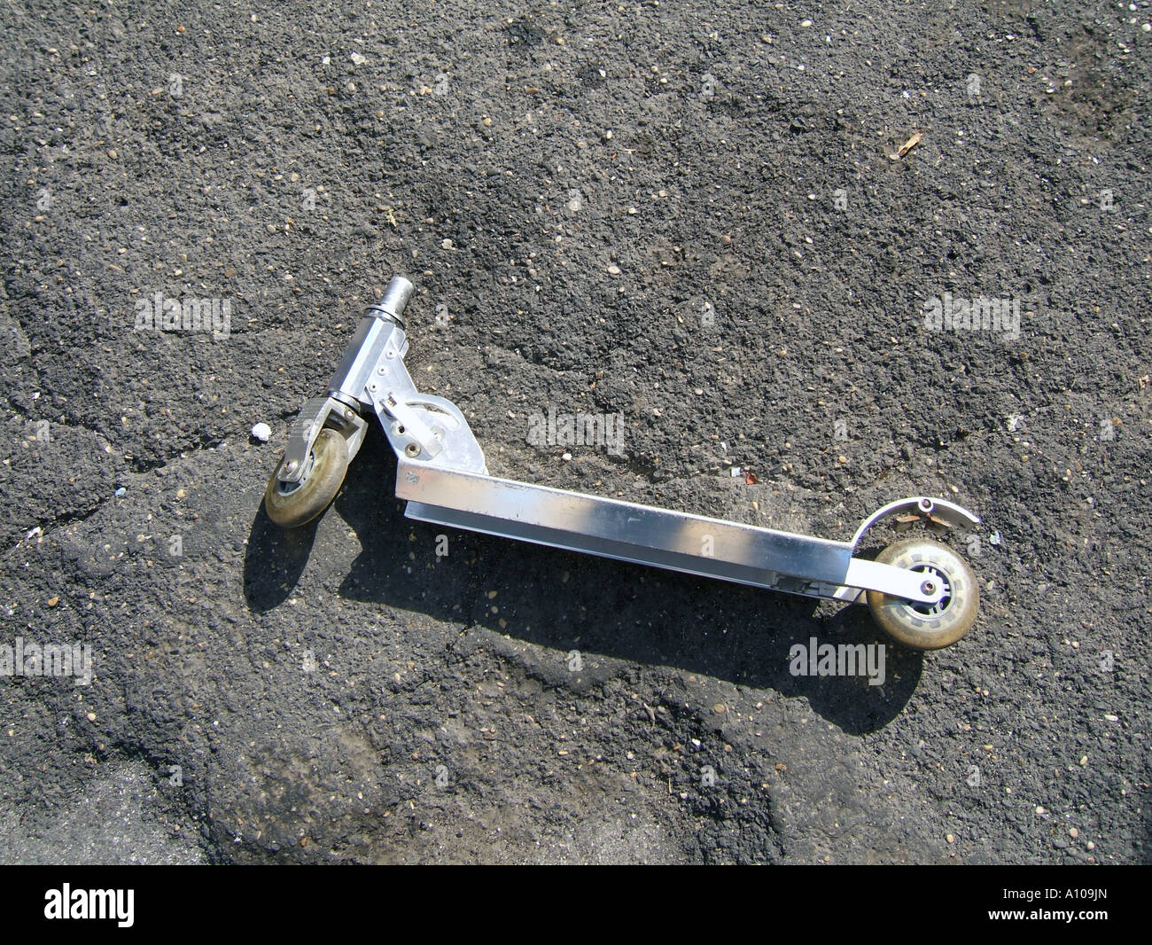 broken toy scooter Stock Photo - Alamy