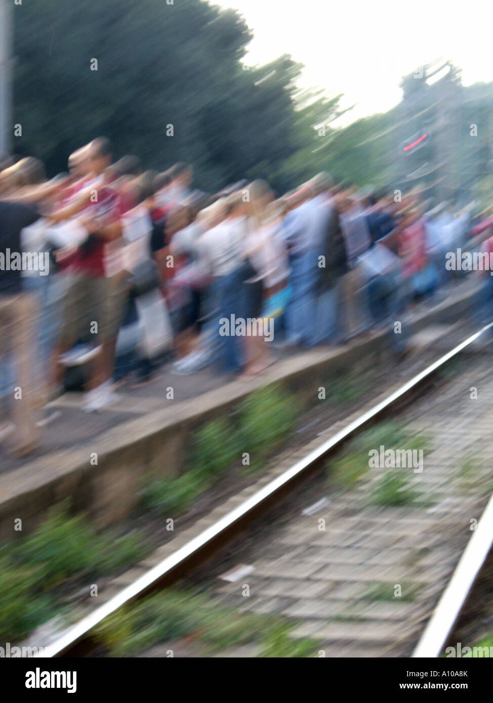 passengers waiting for train on platform Stock Photo - Alamy