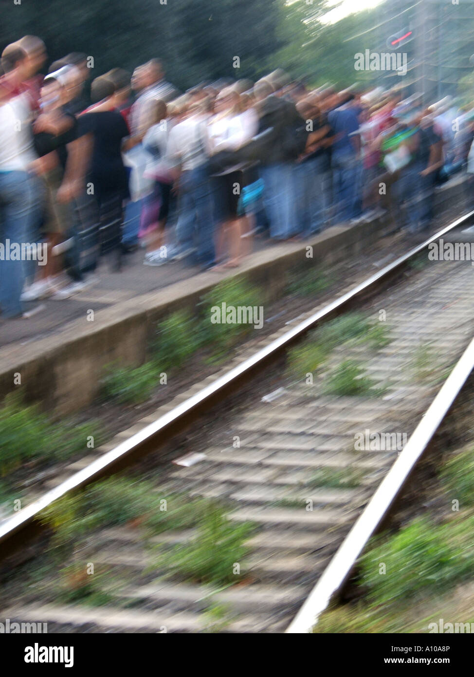 passengers waiting for train on platform Stock Photo - Alamy