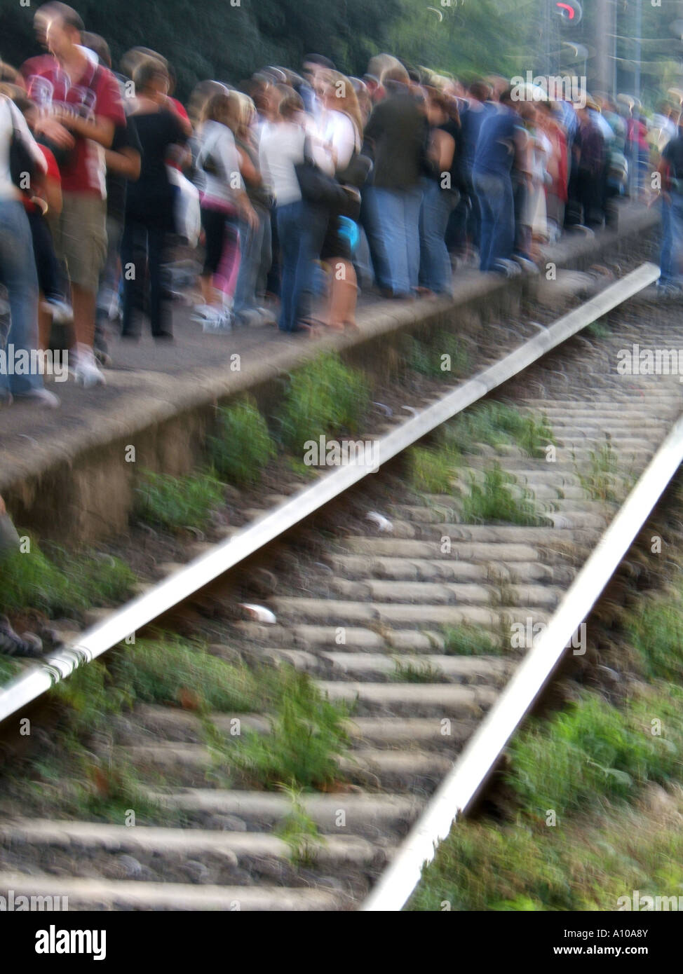 passengers waiting for train on platform Stock Photo - Alamy