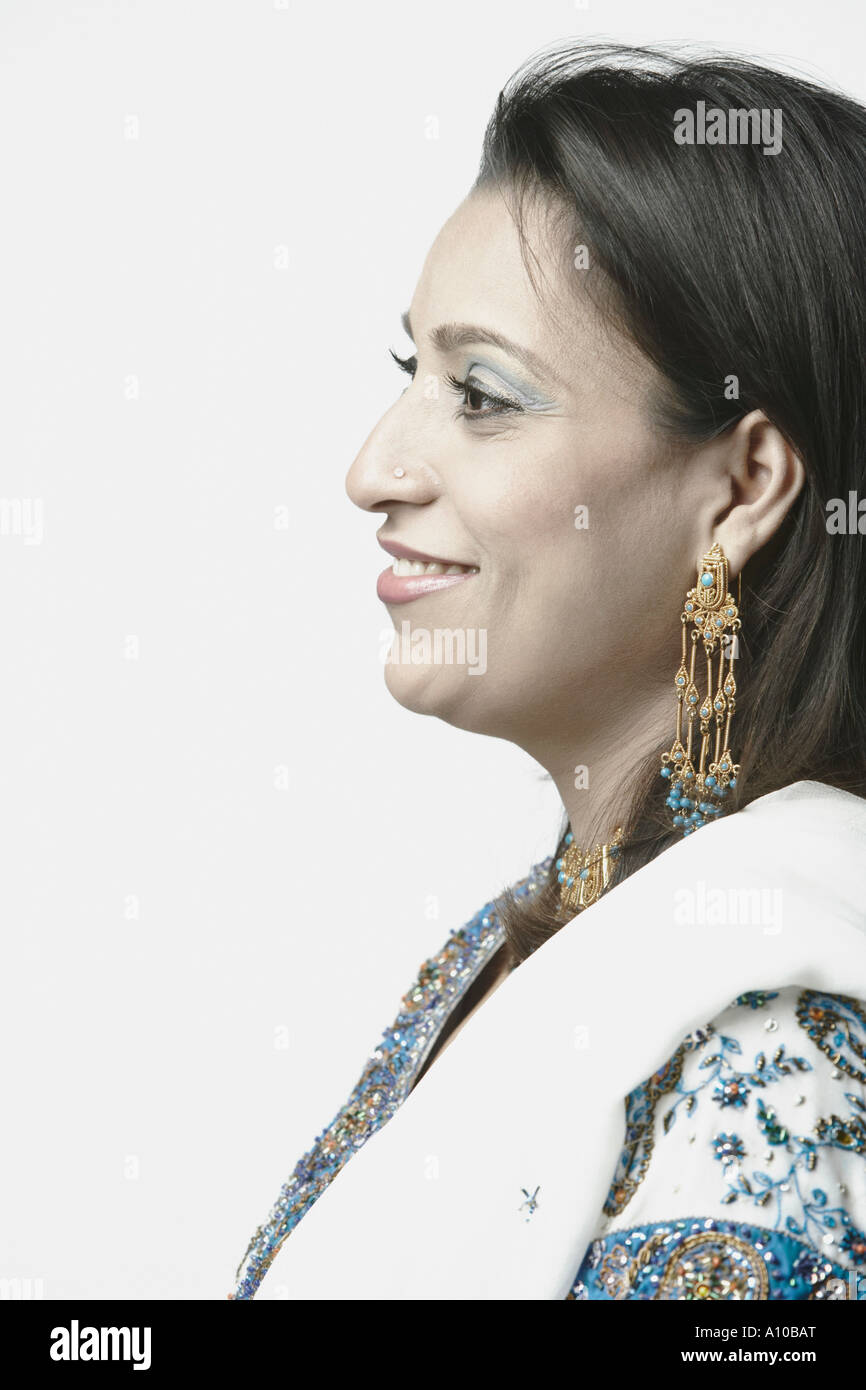 Side profile of a mid adult woman smiling Stock Photo - Alamy