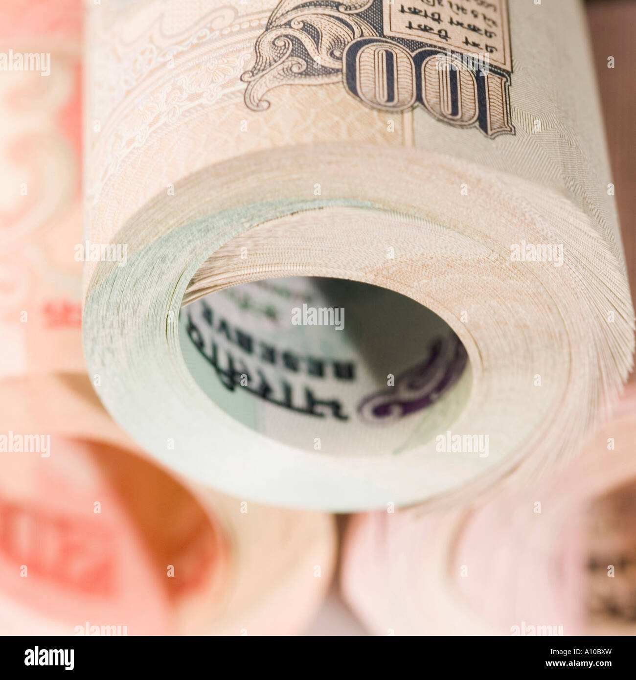 Close-up of a stack of rolled up Indian banknotes Stock Photo - Alamy