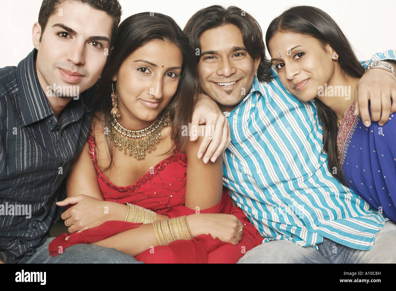 Portrait of two young couples smiling Stock Photo - Alamy