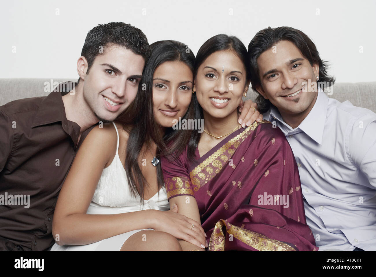 Portrait of two young couples posing Stock Photo - Alamy