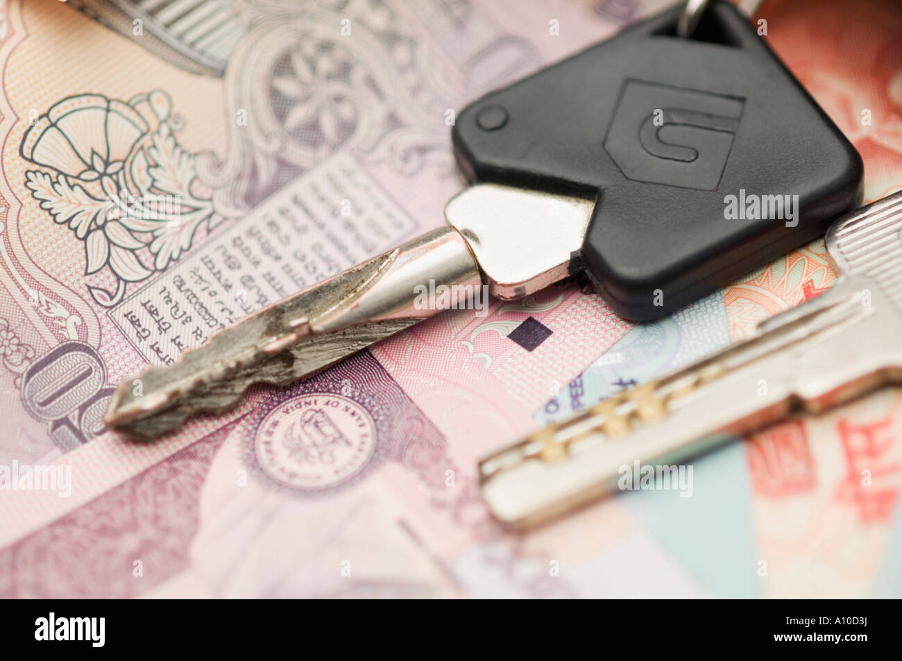 High angle view of car keys on Indian banknotes Stock Photo - Alamy