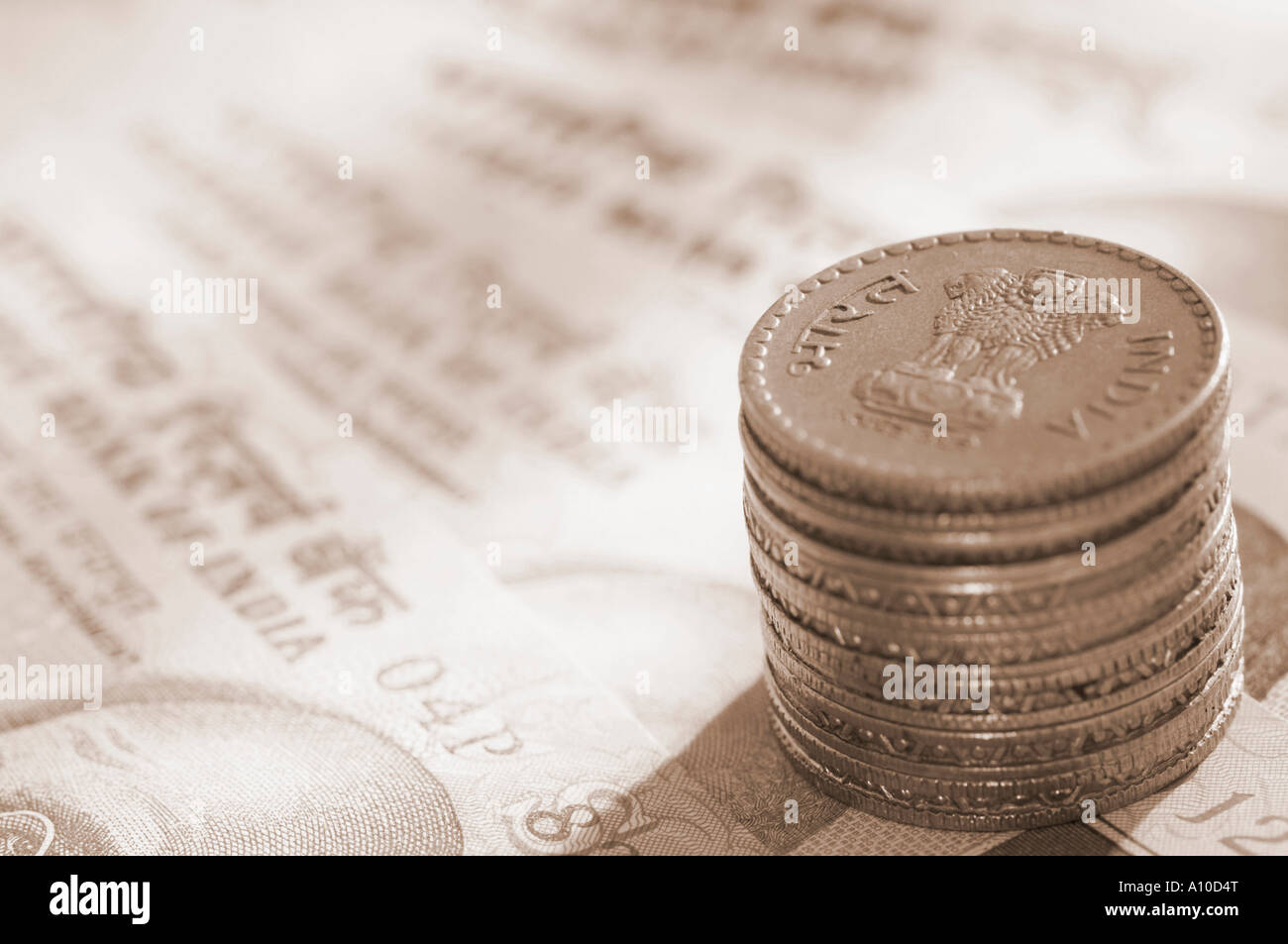 High angle view of a stack of Indian coins on Indian banknotes Stock ...