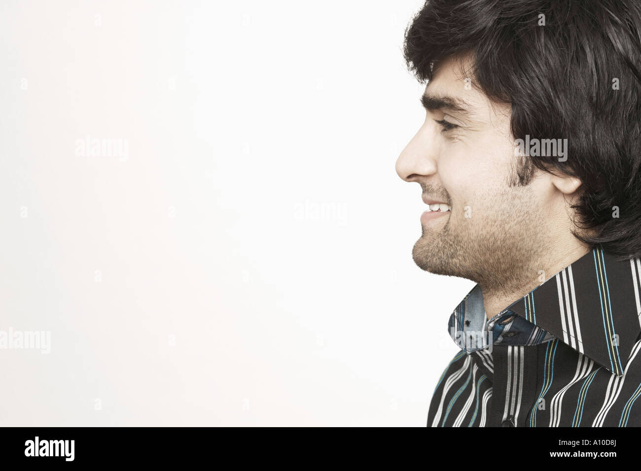 Side profile of a young man smiling Stock Photo - Alamy