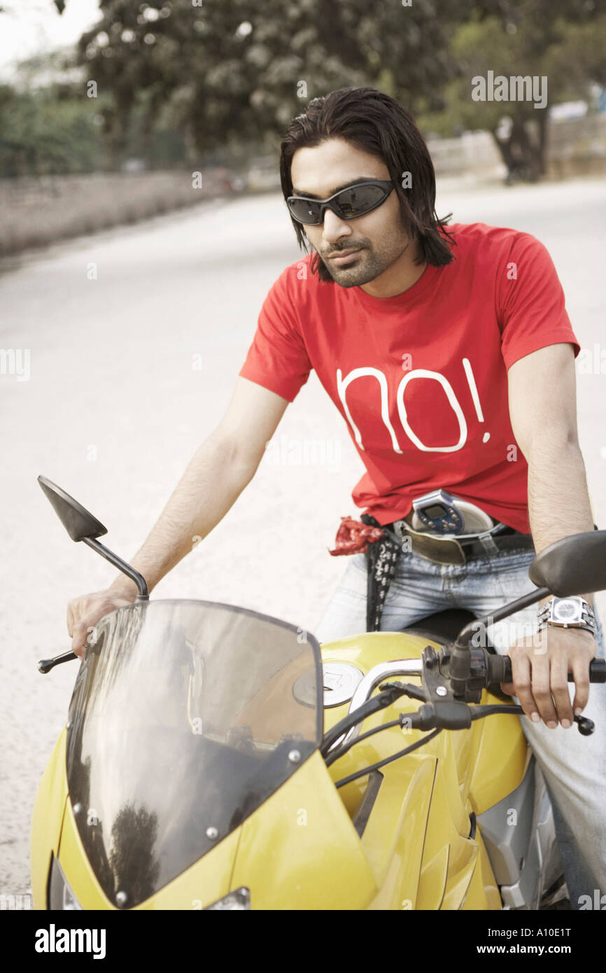 Young man riding a motorcycle Stock Photo - Alamy