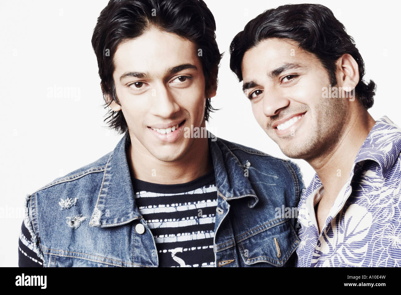 Portrait of two young men smiling Stock Photo - Alamy