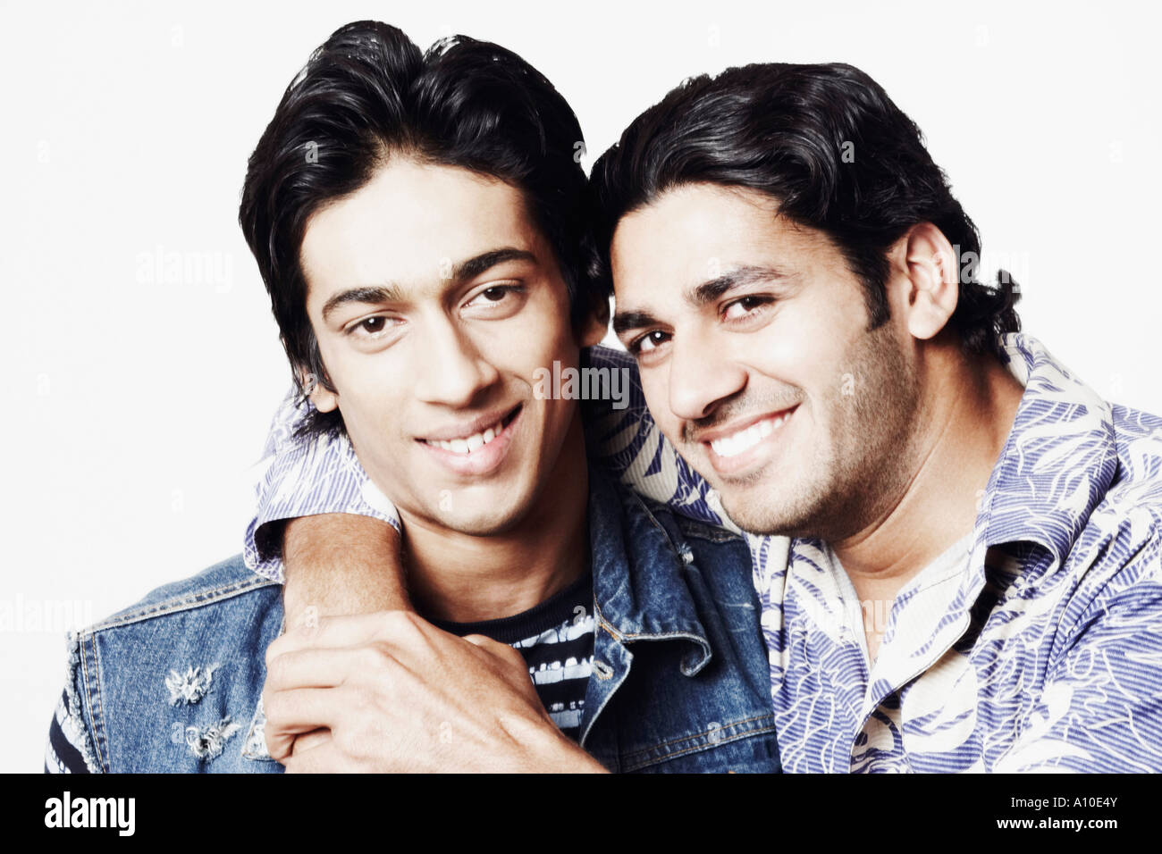 Portrait of two young men smiling Stock Photo - Alamy